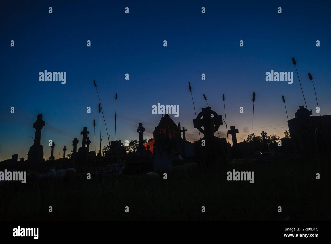 Picture of an old cemetery in Ireland at dusk from a ground perspective ...