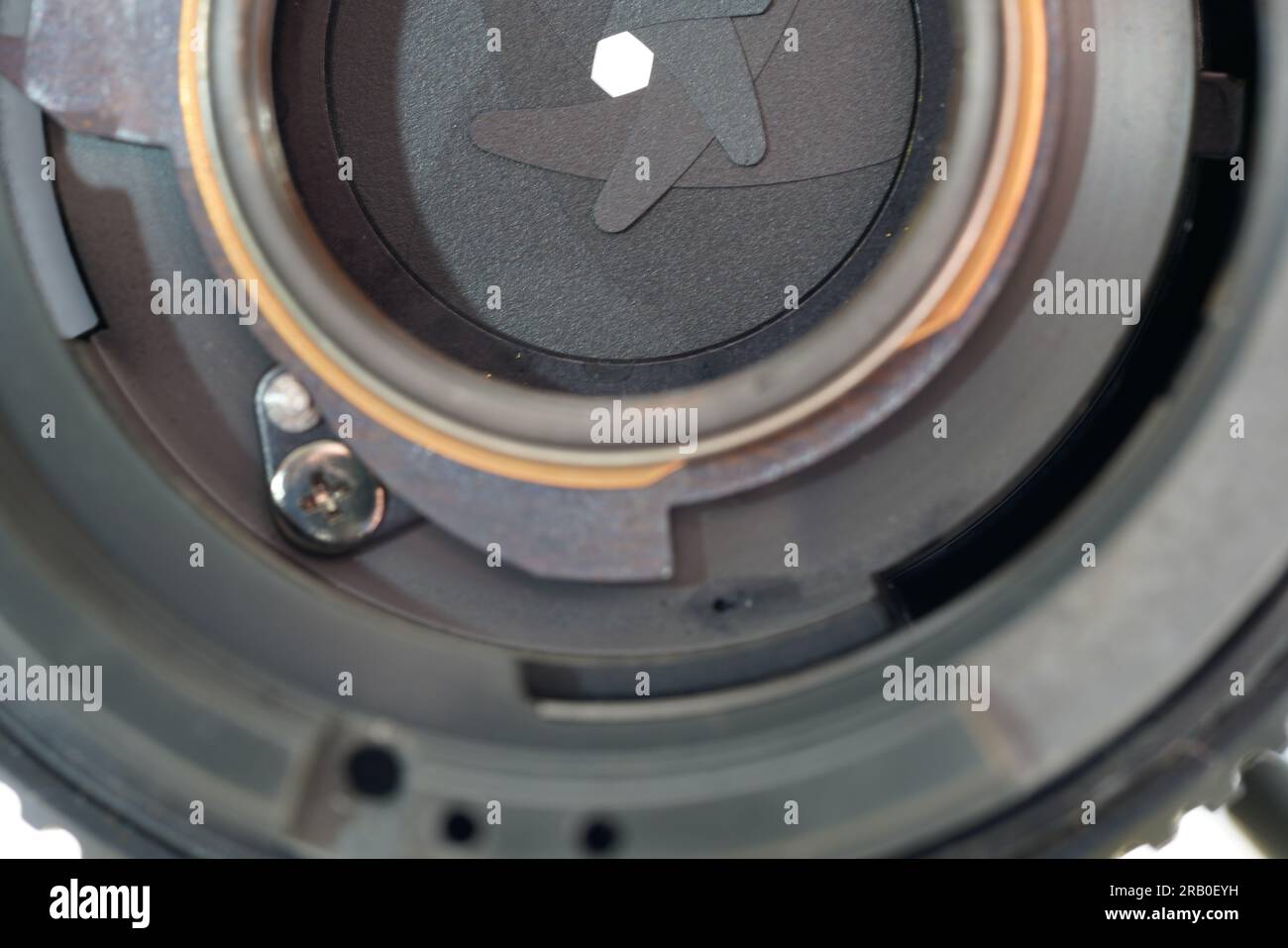 Clean and disassemble the lens for photography into its component parts ...