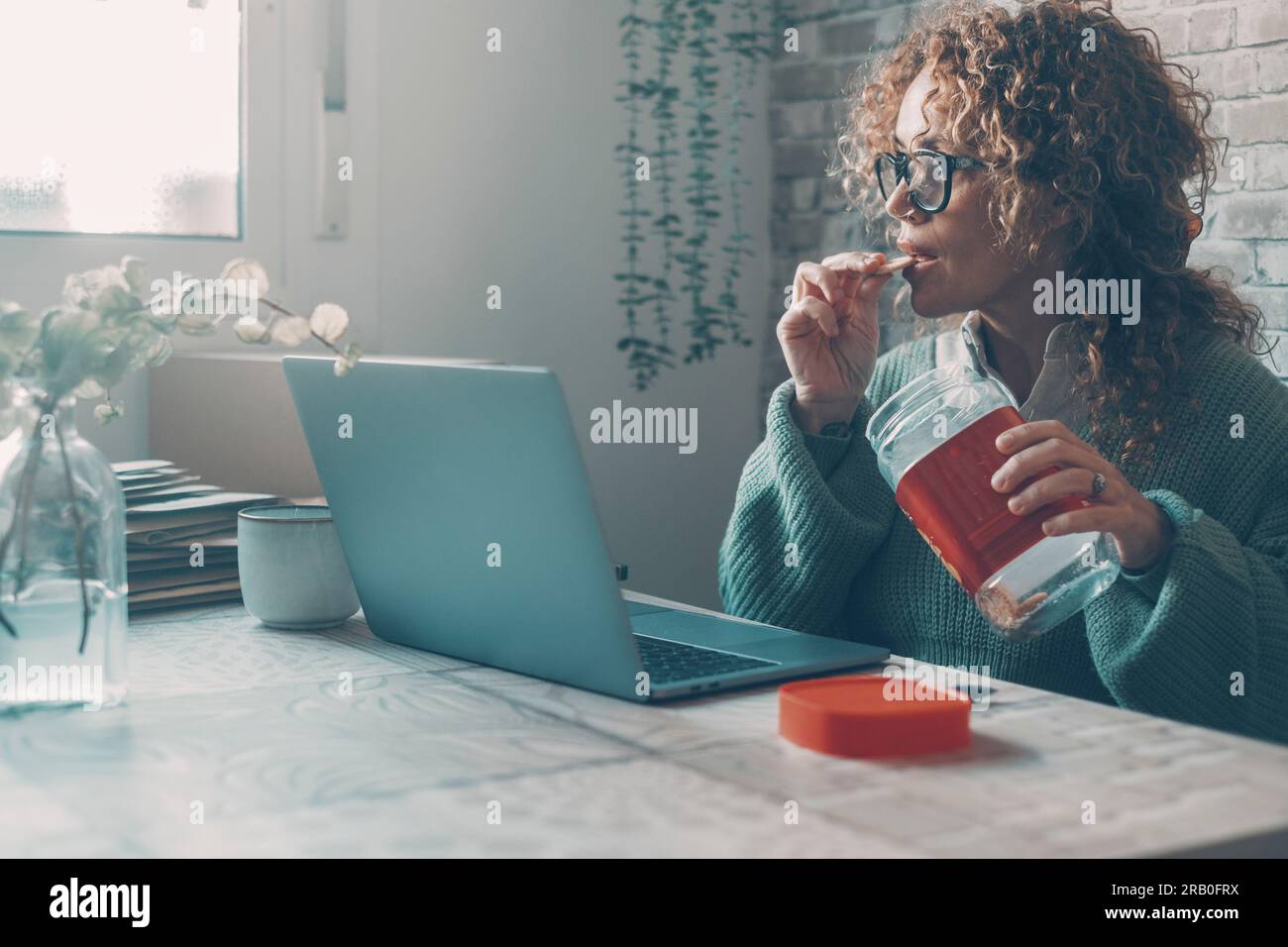 Bad habits woman eating hi-res stock photography and images - Alamy