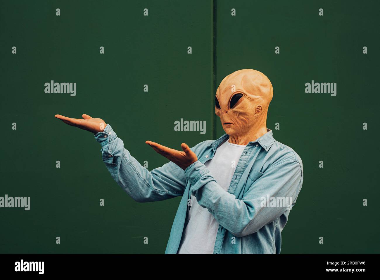 Person in alien mask casual hi-res stock photography and images - Alamy