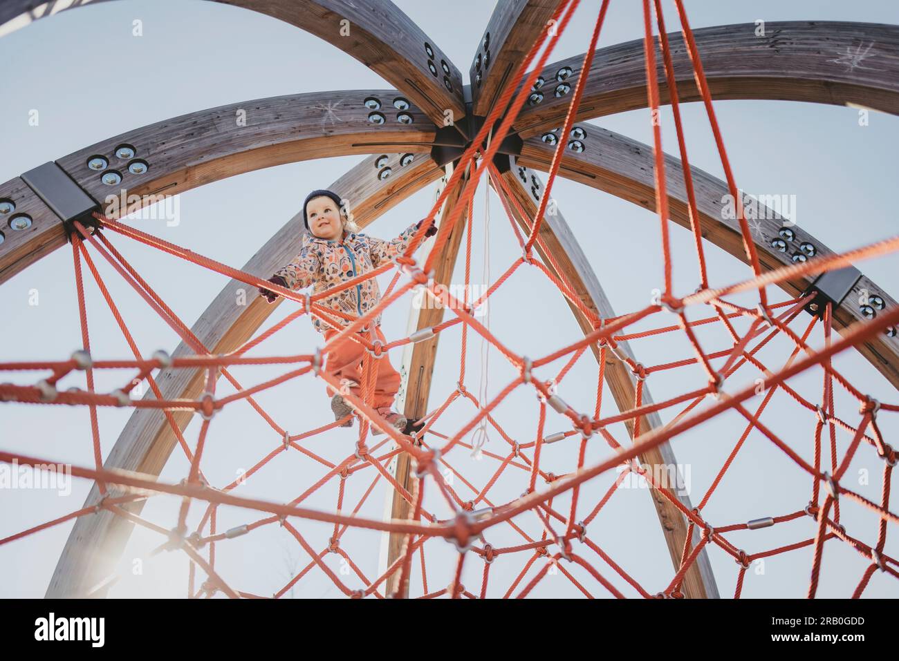 Girl on playground monkey bars hi-res stock photography and images - Alamy