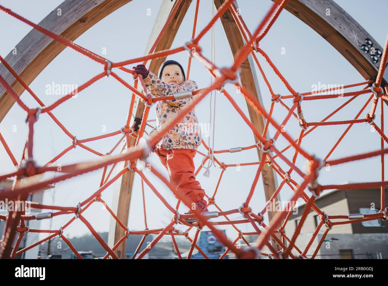 Girl on playground monkey bars hi-res stock photography and images - Alamy