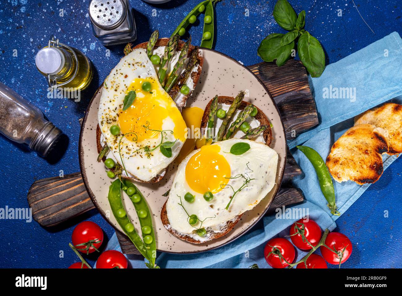 Tasty breakfast sandwiches, toasted bread with cream cheese, asparagus ...