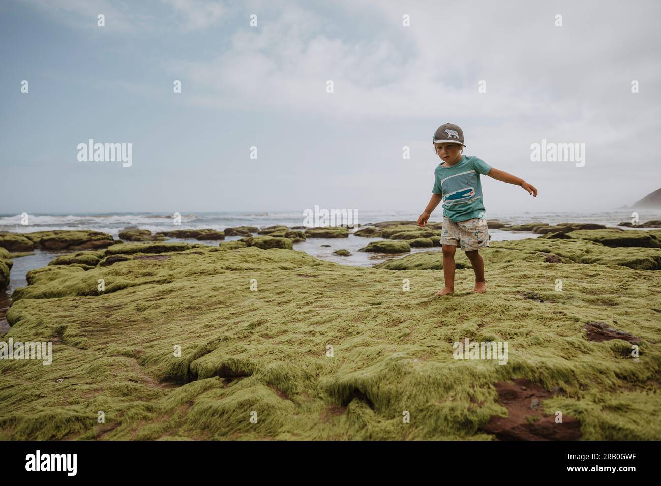 Little boy playing on the beach Stock Photo - Alamy