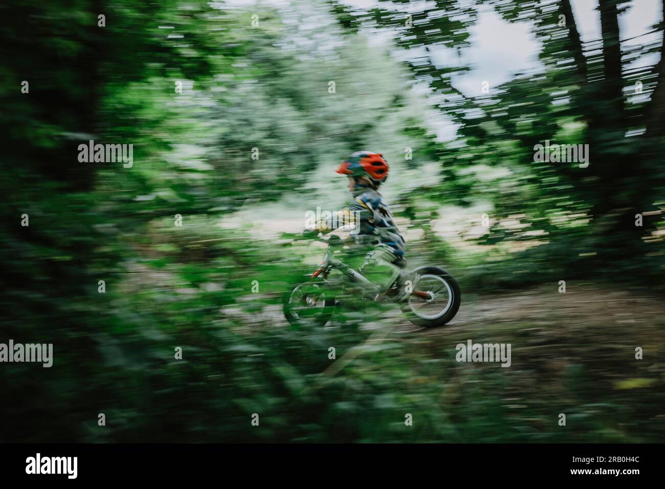 Little boy with running wheel Stock Photo - Alamy