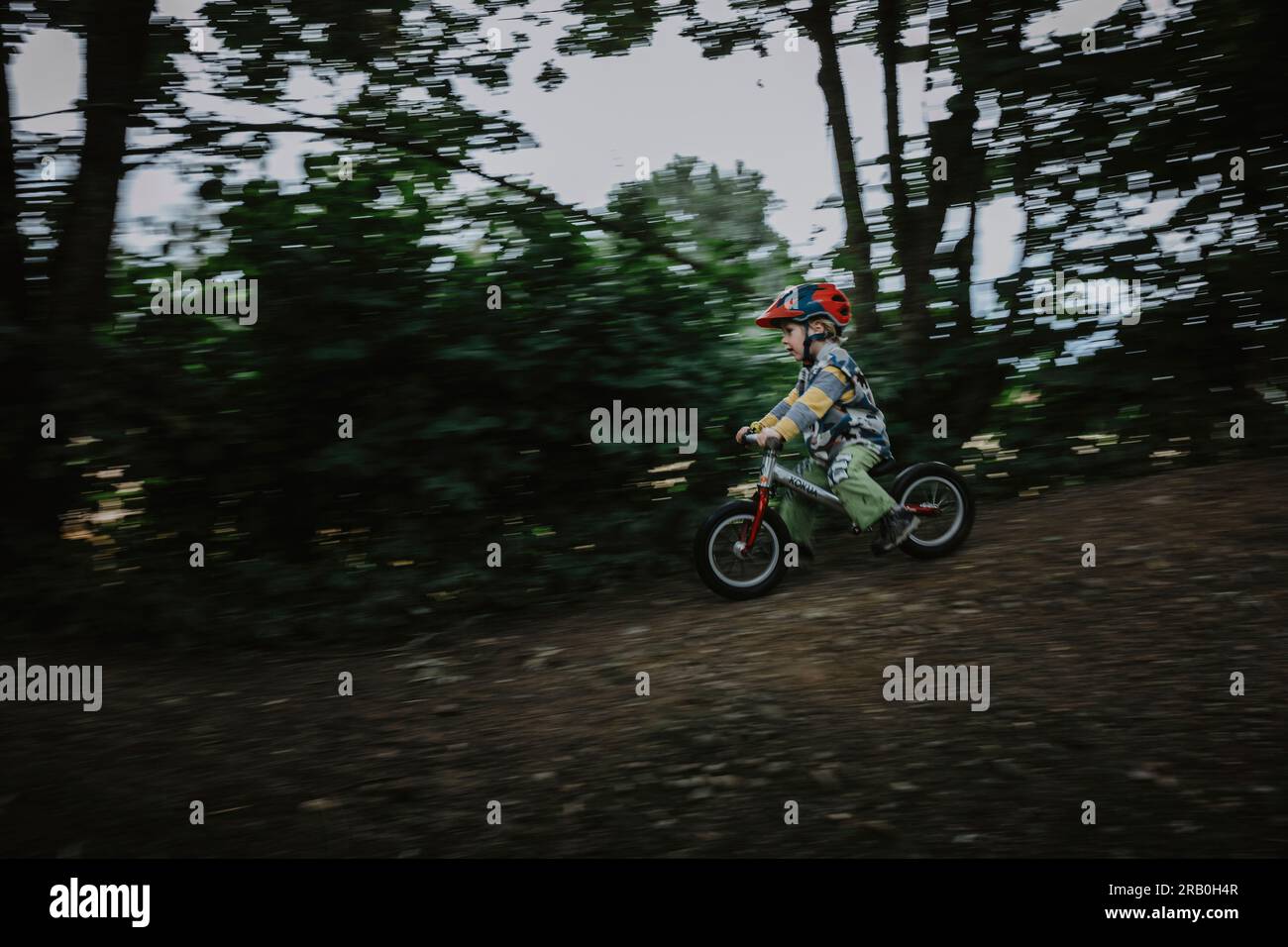 Little boy with running wheel Stock Photo - Alamy