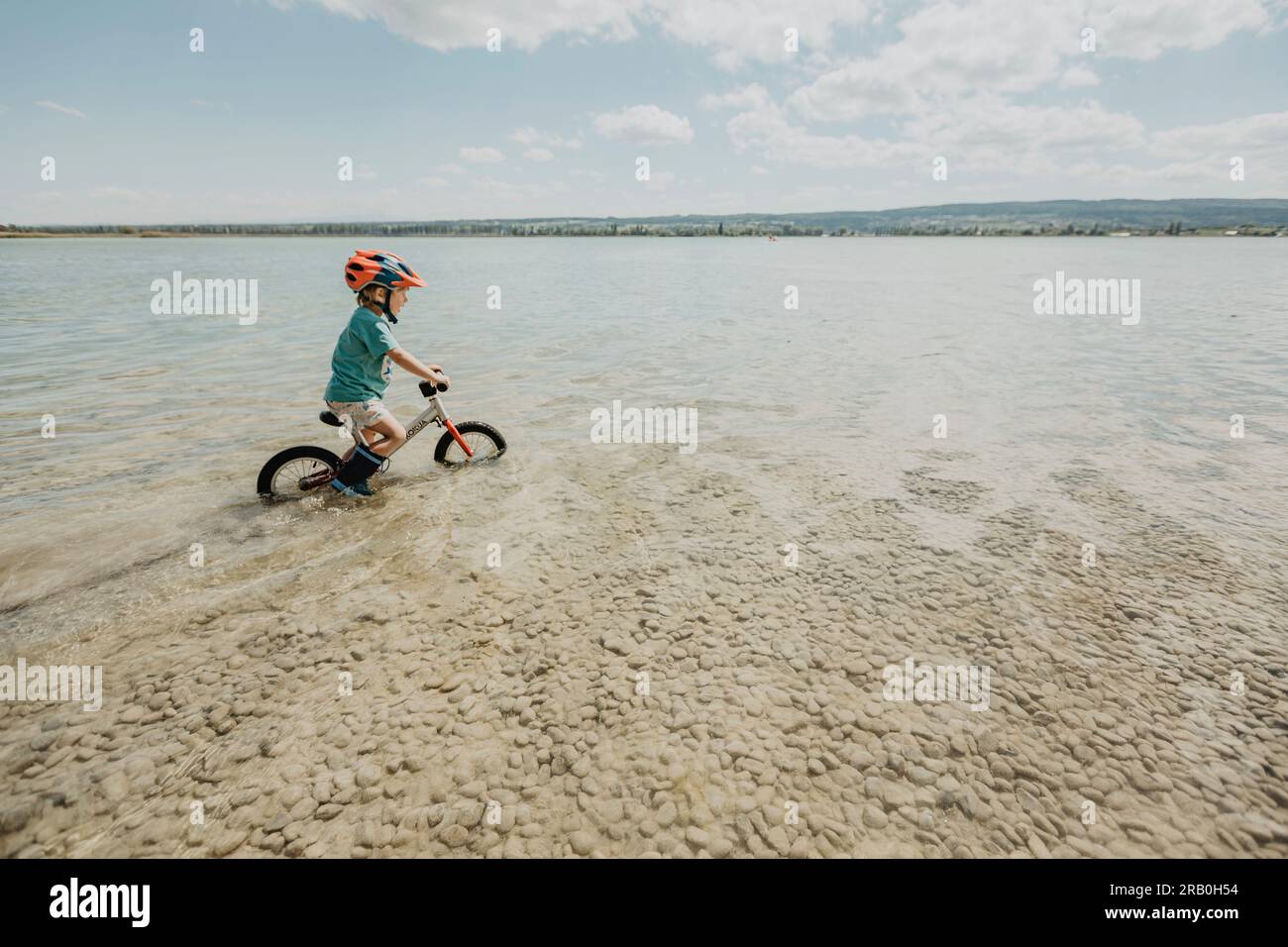 Little boy with running wheel Stock Photo - Alamy