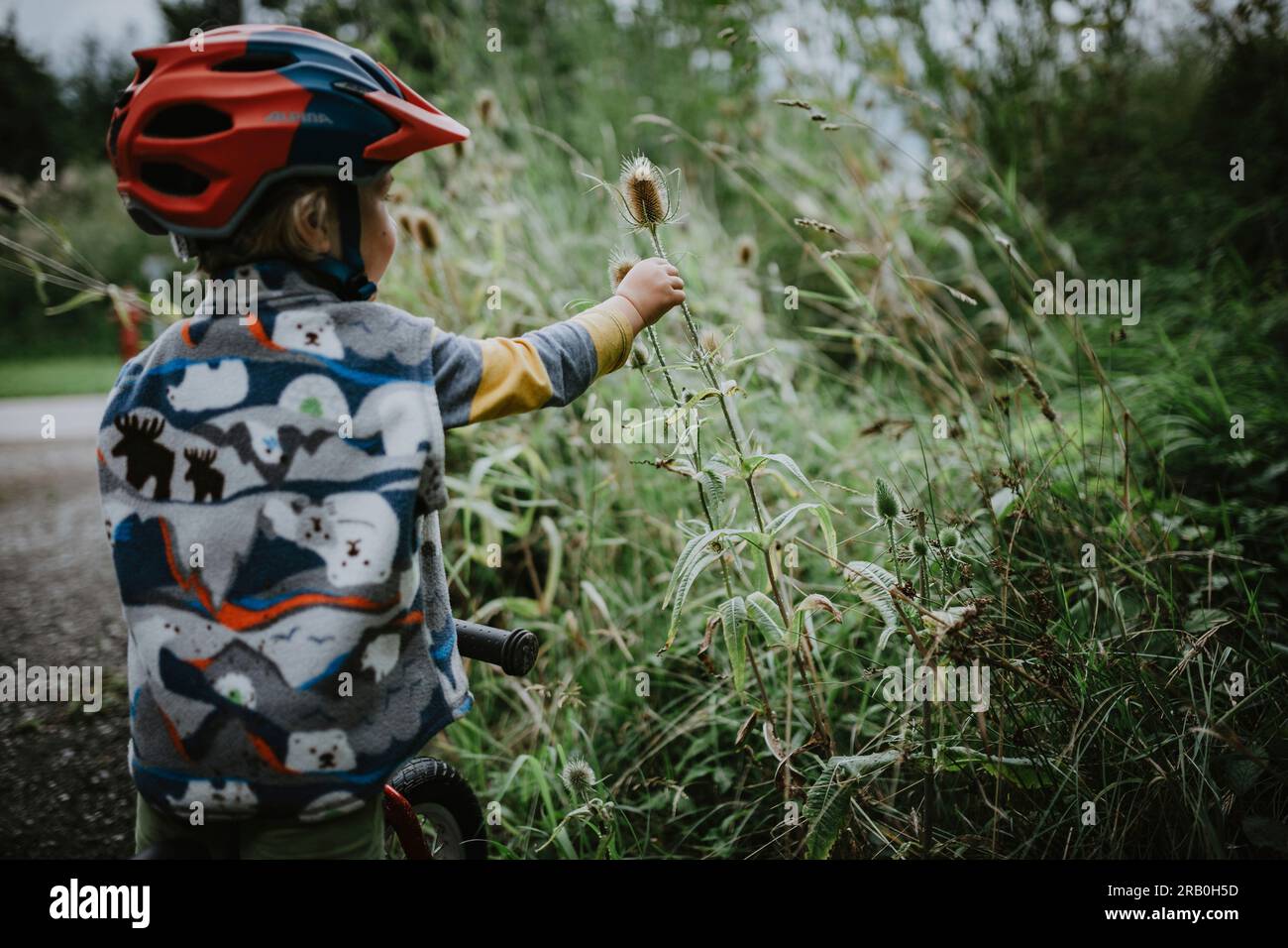 Little boy with running wheel Stock Photo - Alamy