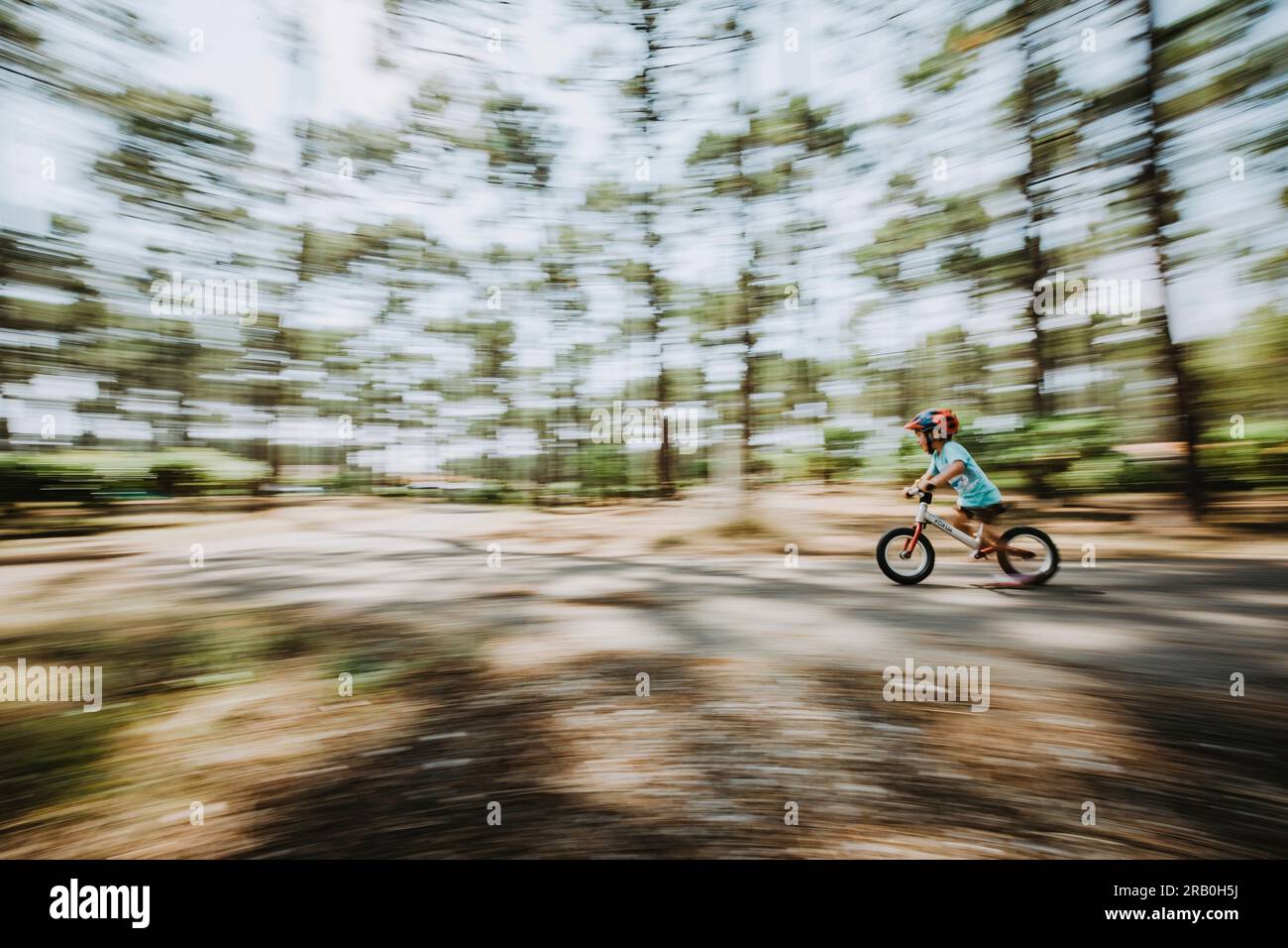 Little boy with running wheel Stock Photo - Alamy