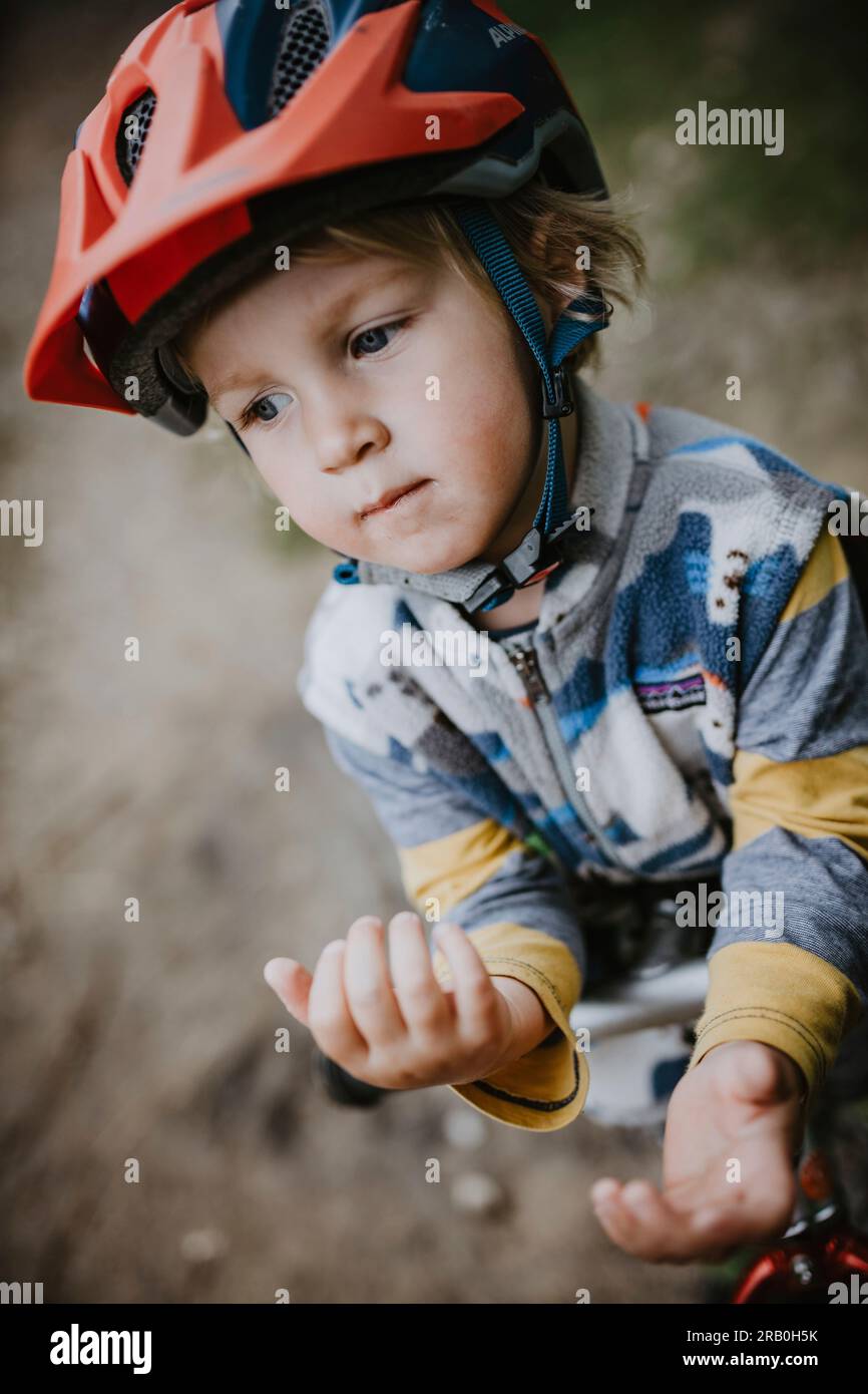 Little boy with running wheel Stock Photo - Alamy