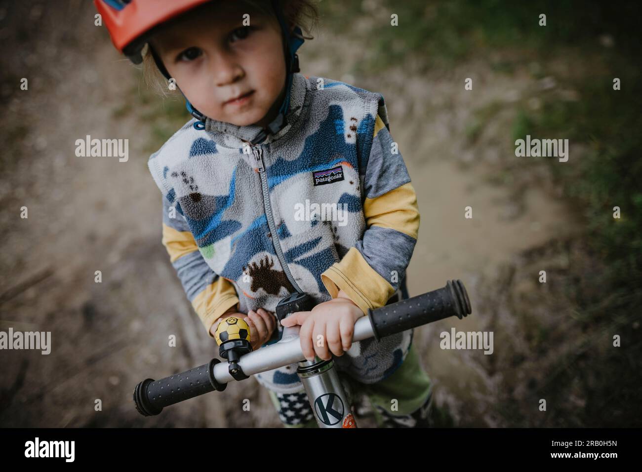 Little boy with running wheel Stock Photo - Alamy
