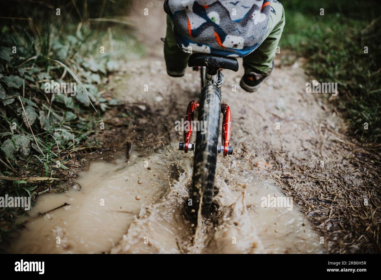 Little boy with running wheel Stock Photo - Alamy