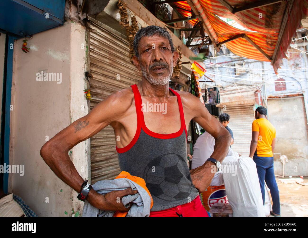 Portrait of a tired indian worker in old Delhi, Delhi, New Delhi, India ...