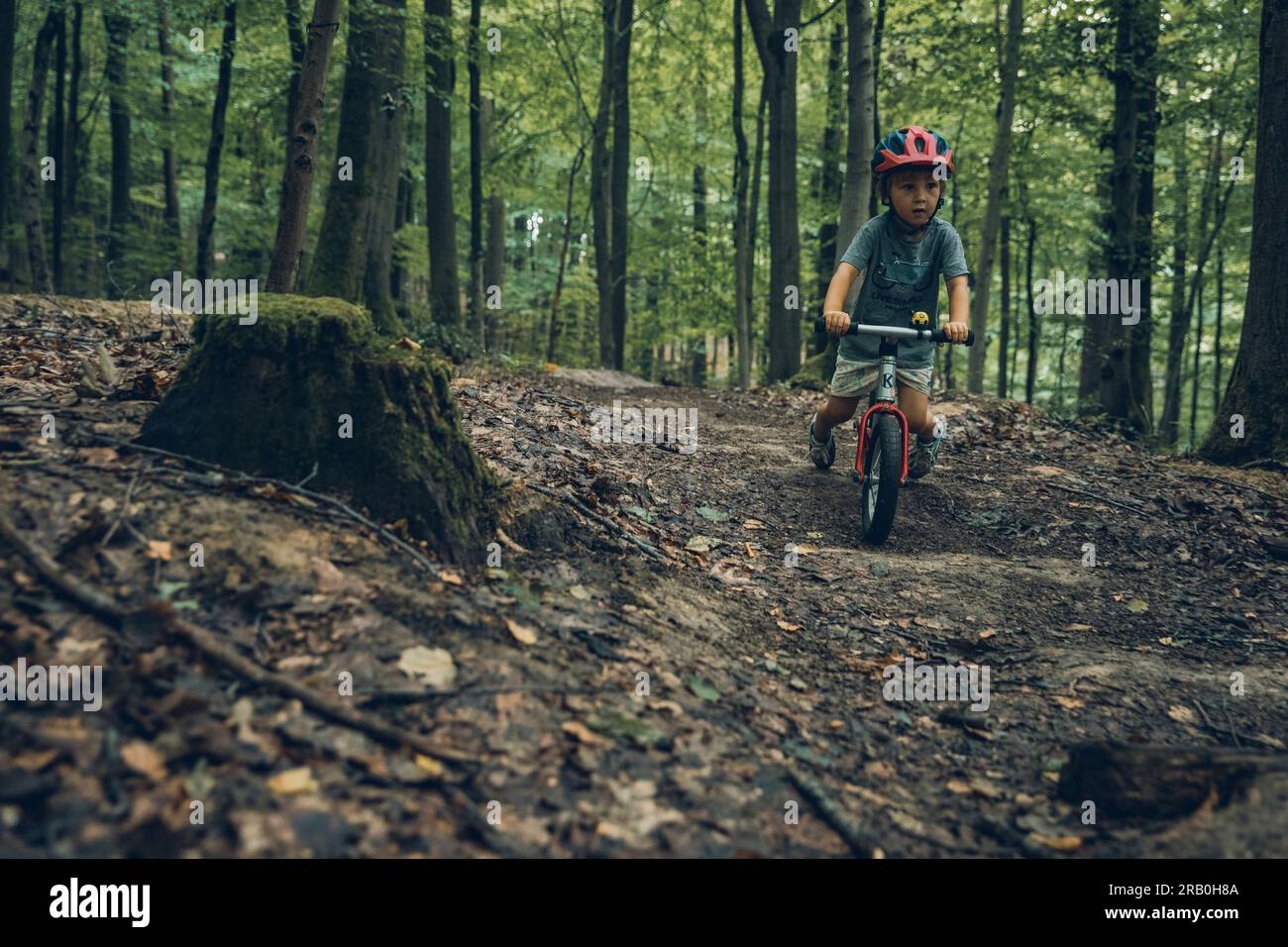 Little boy with running wheel Stock Photo - Alamy