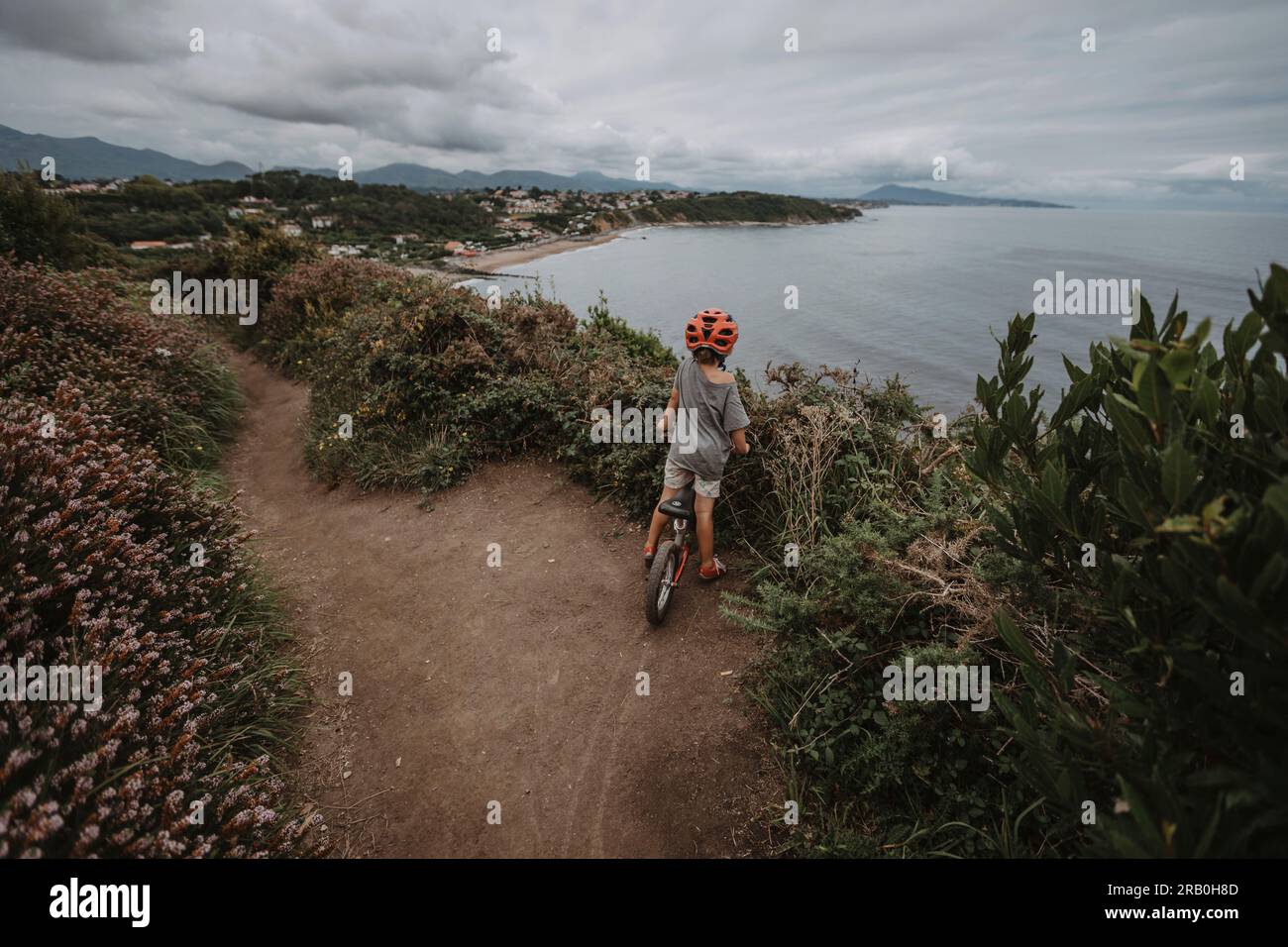 Little boy with running wheel Stock Photo - Alamy