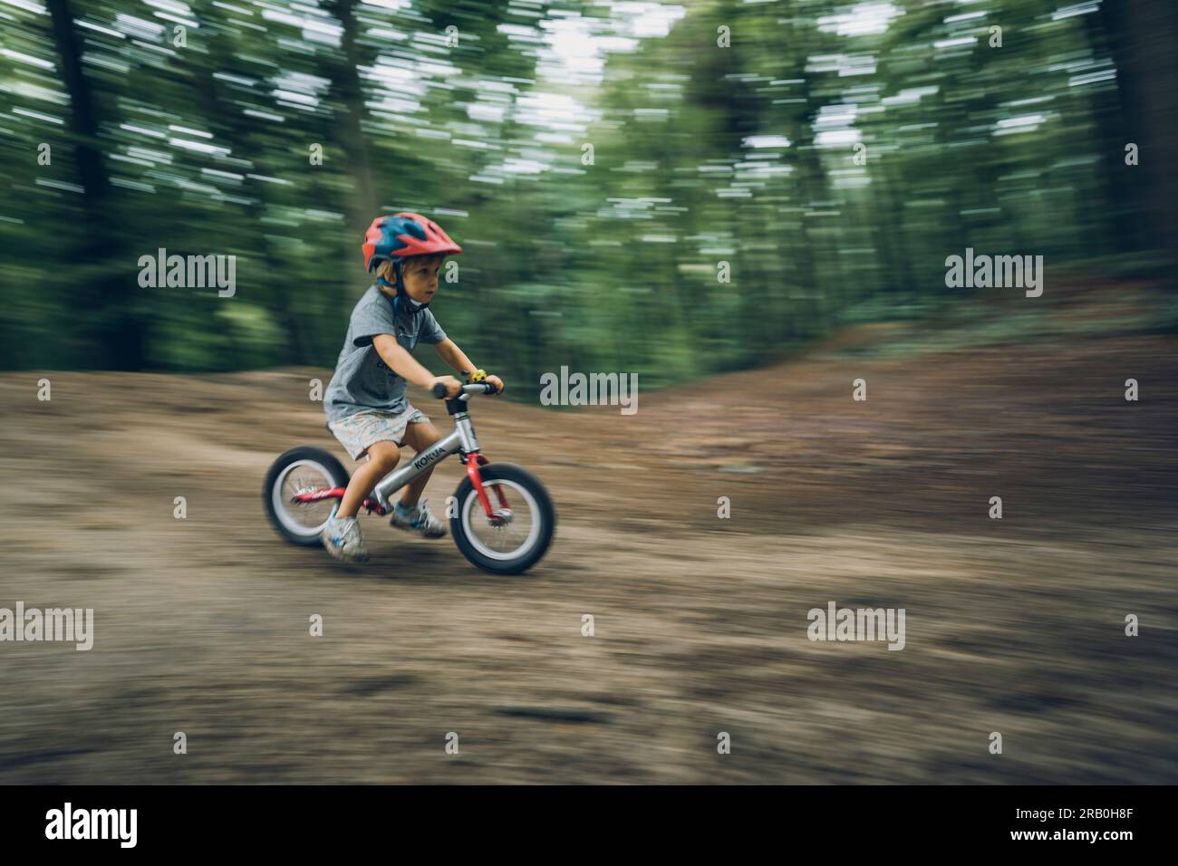 Little boy with running wheel Stock Photo - Alamy