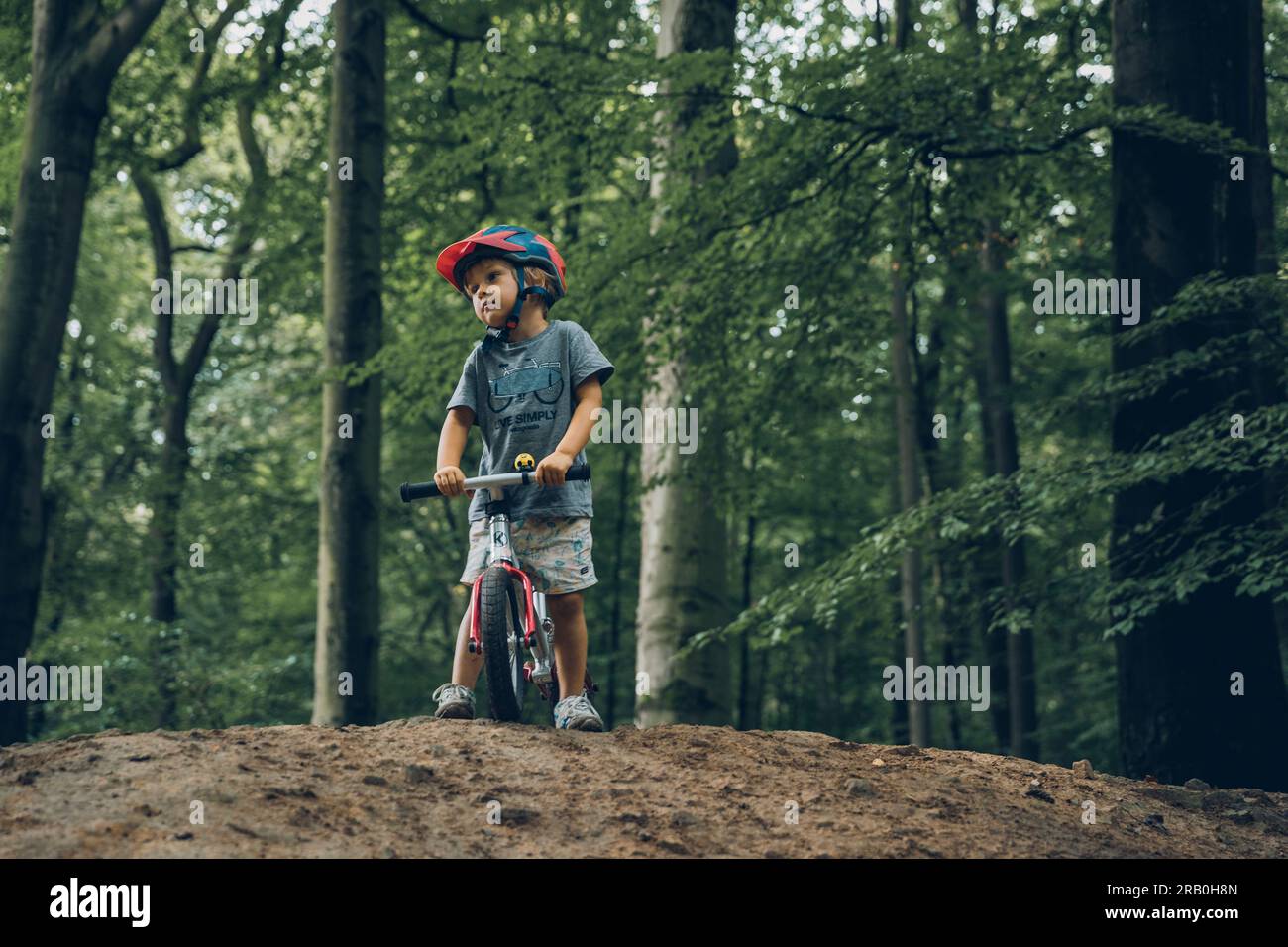 Little boy with running wheel Stock Photo - Alamy