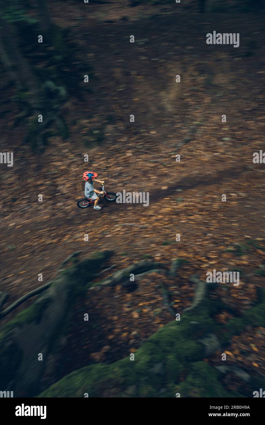 Little boy with running wheel Stock Photo - Alamy