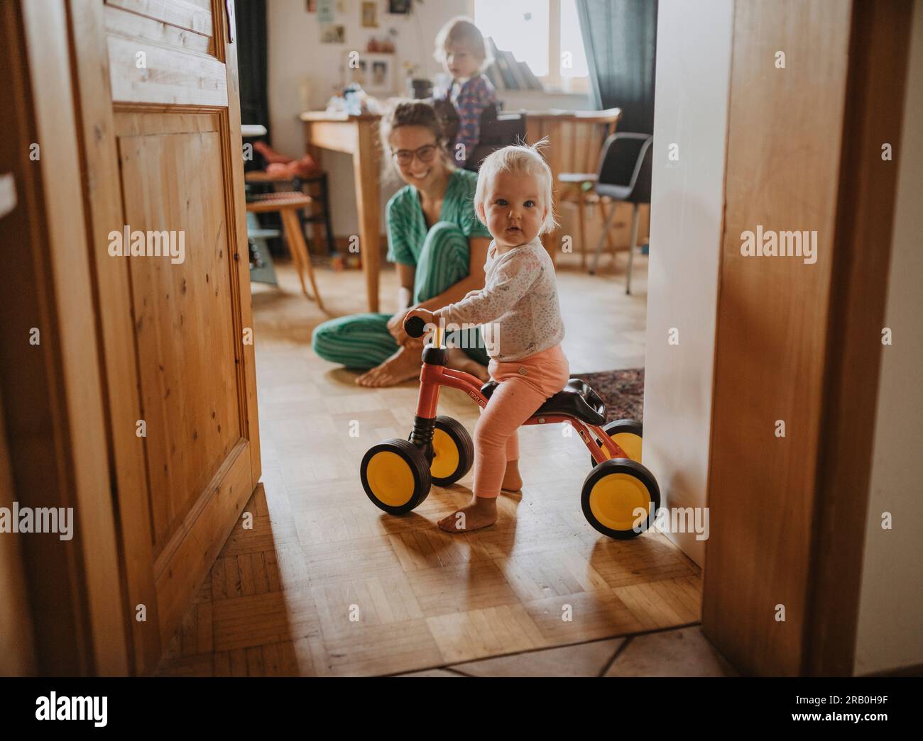 Little girl with running wheel Stock Photo - Alamy Little girl with running wheel Stock Photo - Alamy