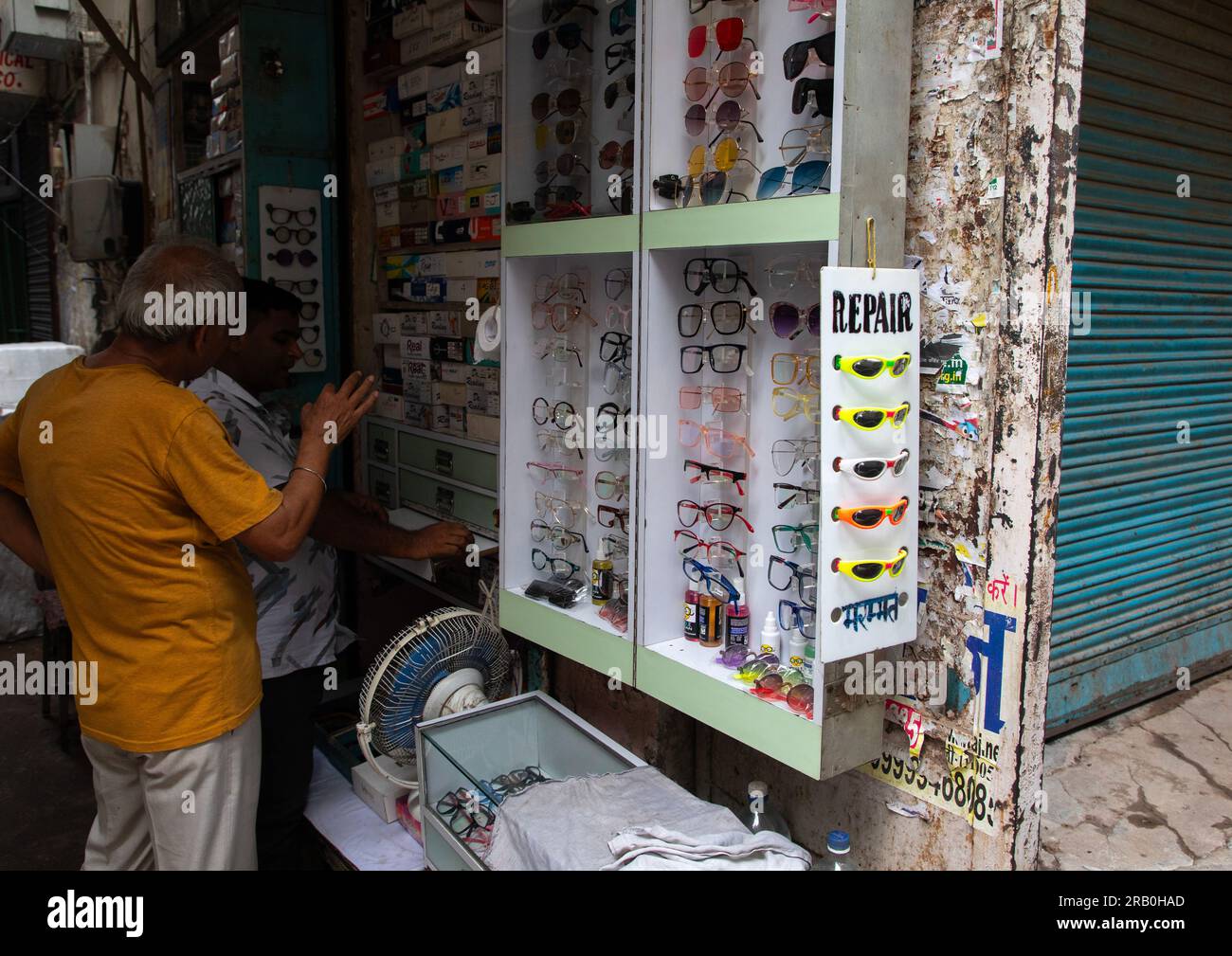 Indian man choosing eyeglasses in a optics, Delhi, New Delhi, India ...