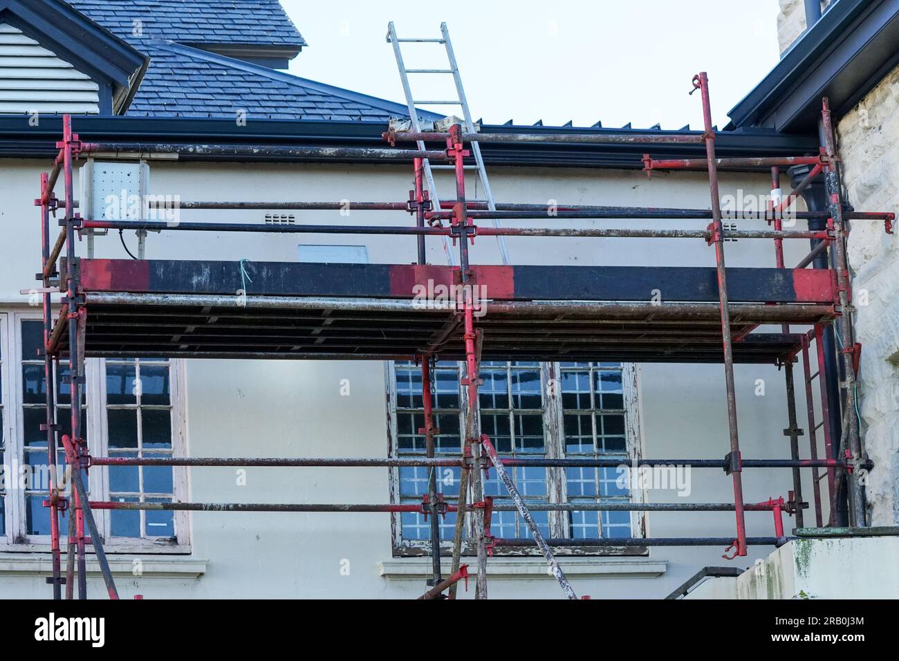scaffolding against an old building during renovations or maintenance ...
