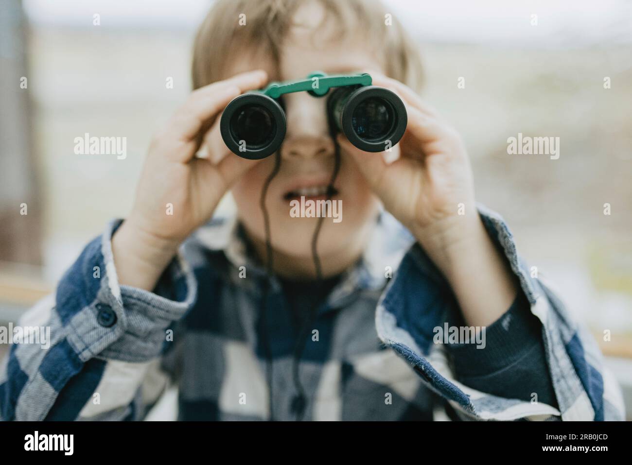 Teen boy with binoculars hi-res stock photography and images - Alamy