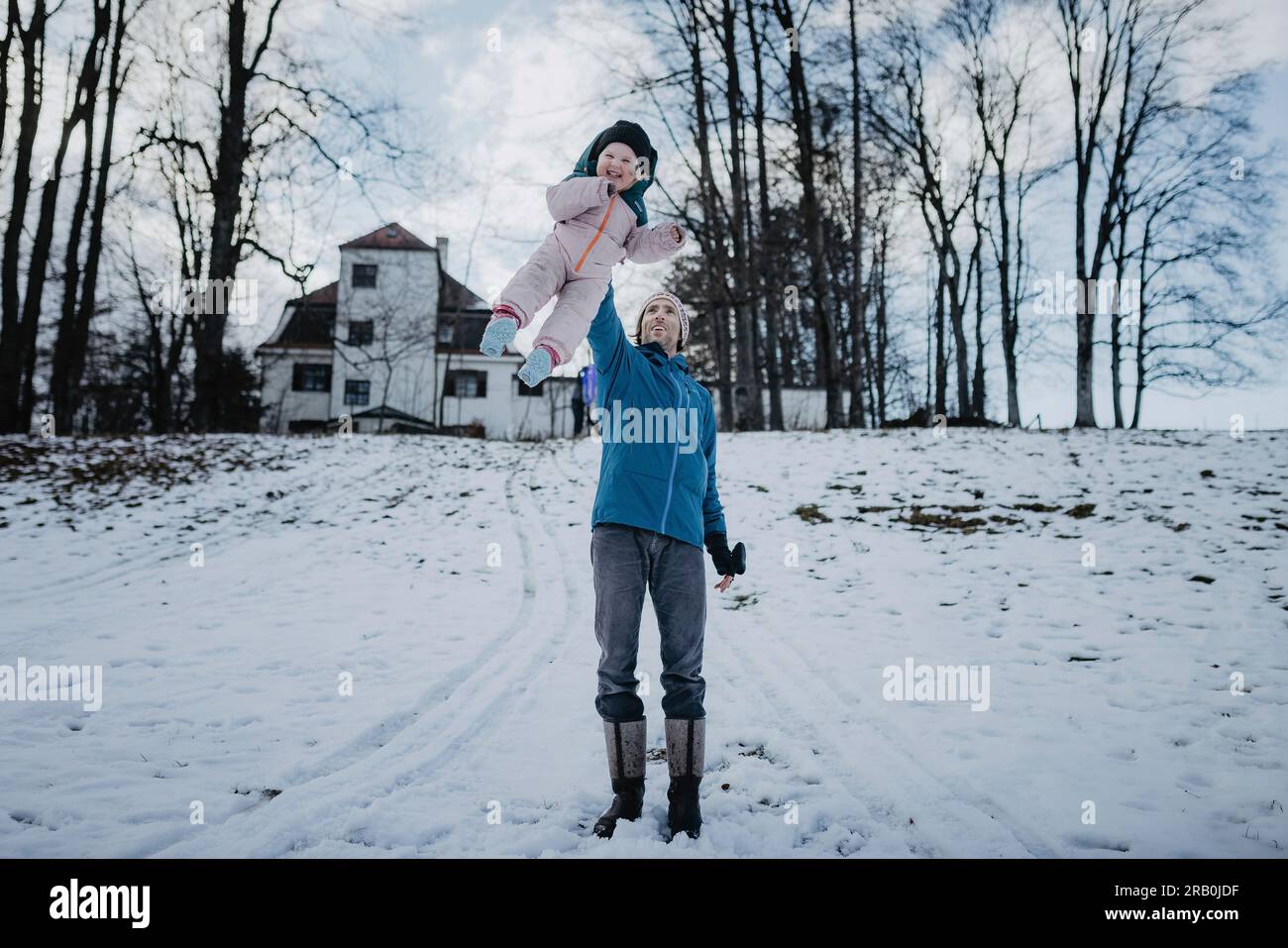 Man lifting daughter in hi-res stock photography and images - Alamy