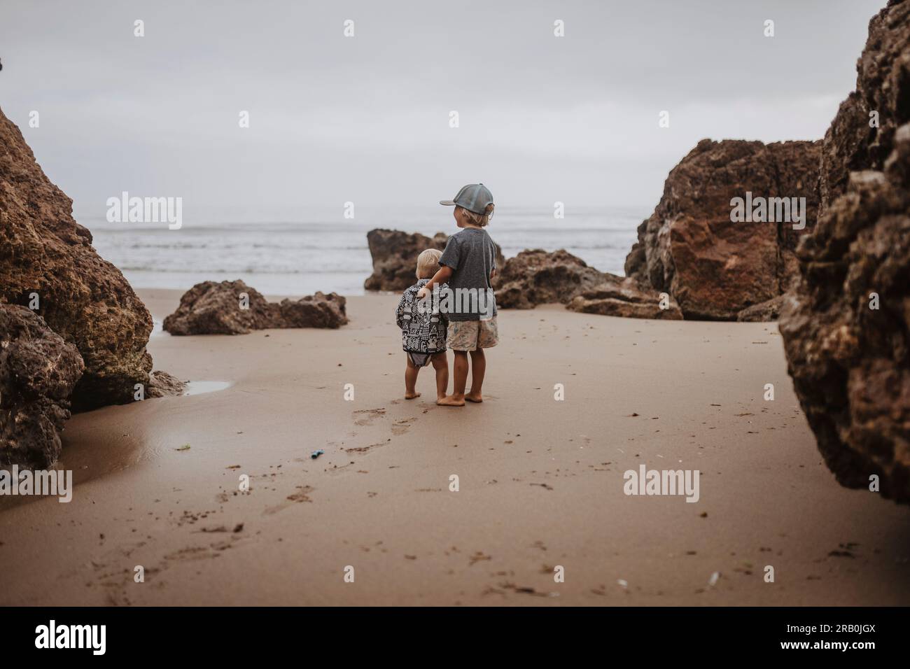 Brother and sister on the beach Stock Photo - Alamy