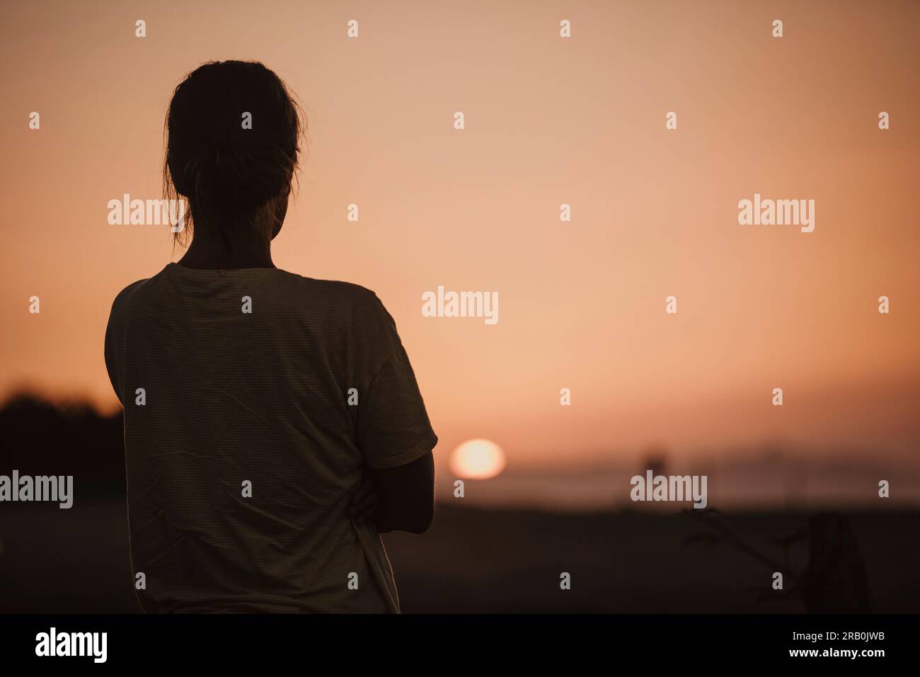 Standing woman gazing in hi-res stock photography and images - Alamy