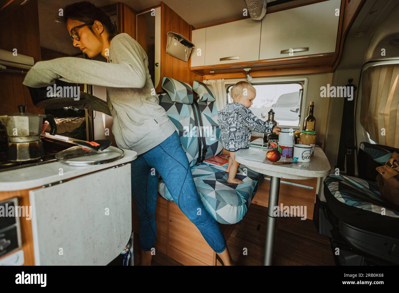 Family having breakfast in camper Stock Photo - Alamy