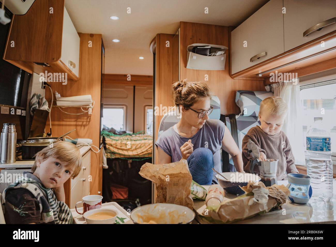 Family having breakfast in camper Stock Photo - Alamy