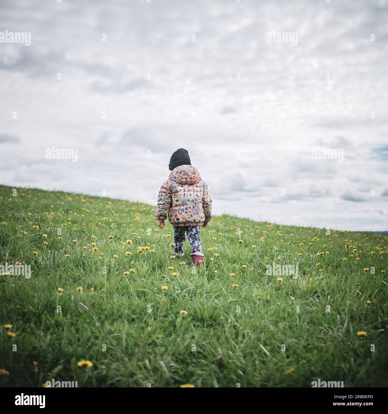 Little girl running across a meadow hi-res stock photography and images ...