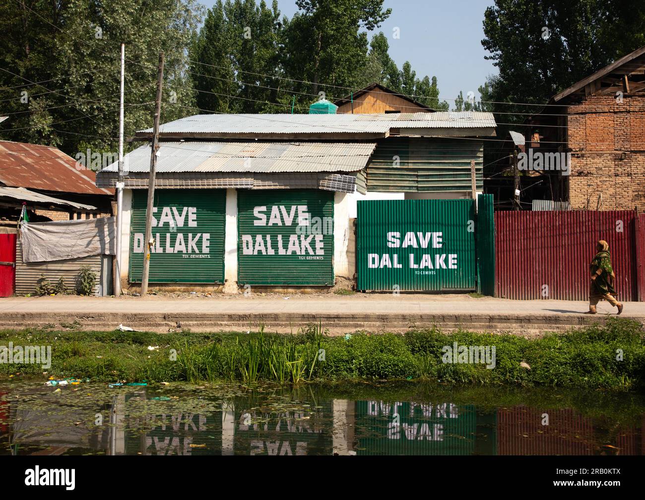 Save Dal Lake billboard on houses for lake conservation, Jammu and ...