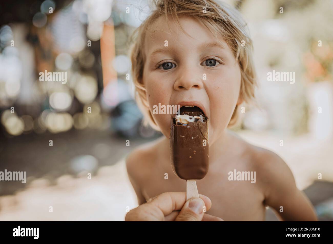 Little boy eating ice cream Stock Photo - Alamy