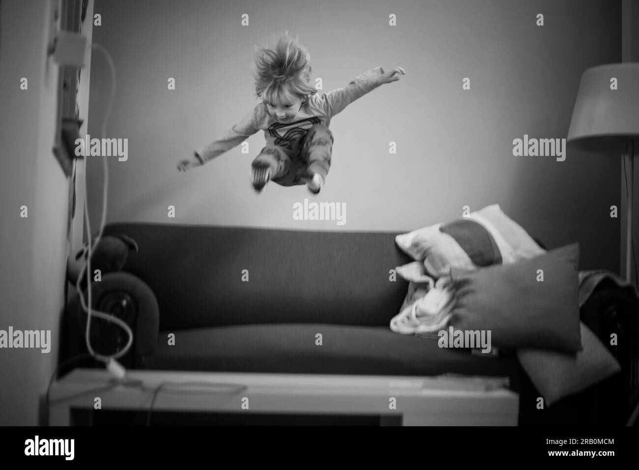 Boy bouncing Black and White Stock Photos & Images - Alamy