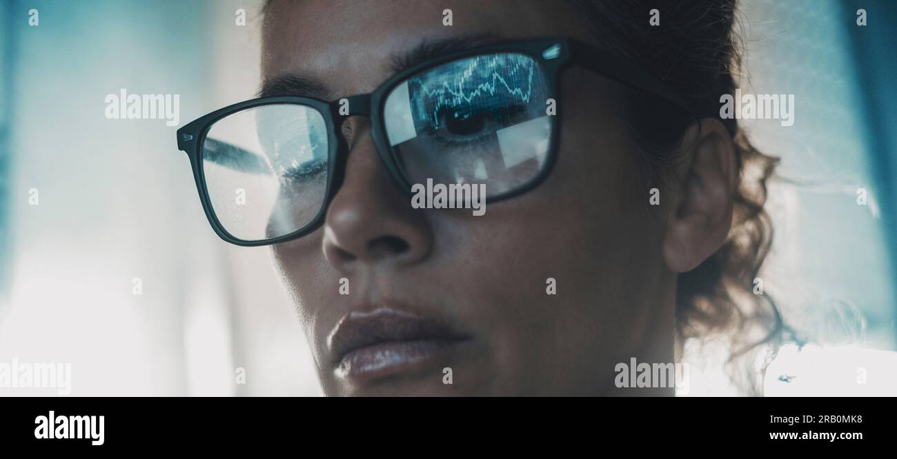 Close up of woman face with charts reflecting on eyewear. Female modern ...