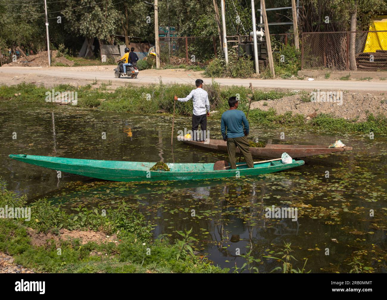 Indian men cleaning a canal, Jammu and Kashmir, Srinagar, India Stock ...
