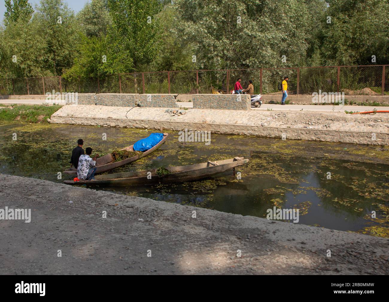Indian men cleaning a canal, Jammu and Kashmir, Srinagar, India Stock ...