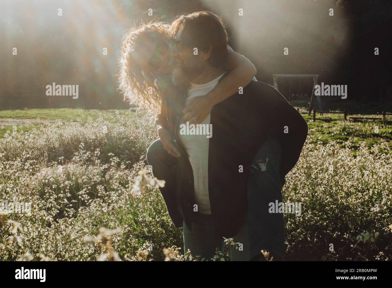 Romantic man carrying woman in hi-res stock photography and images - Alamy