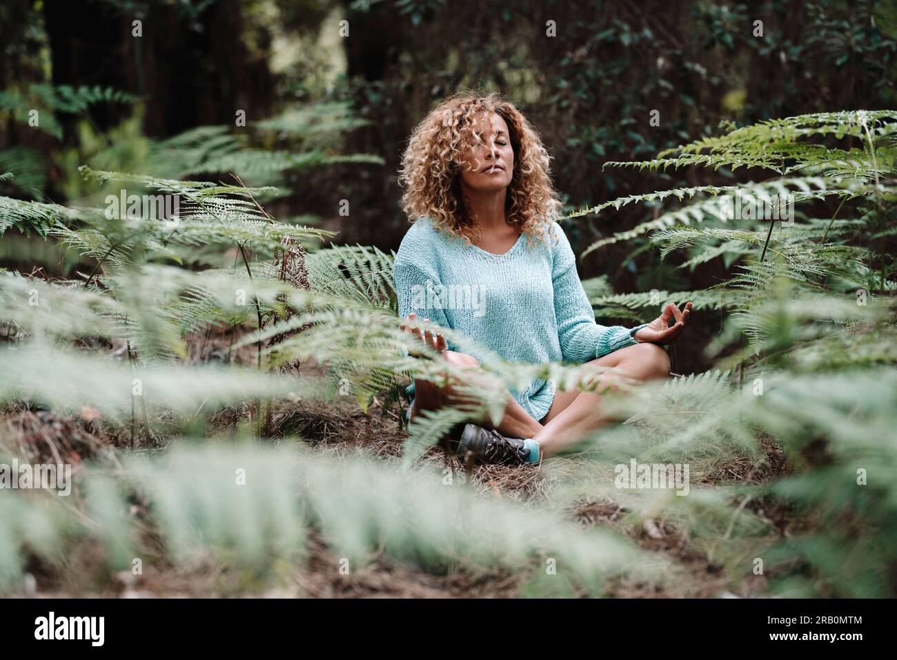 Health natural lifestyle meditation woman in the forest park with green ...