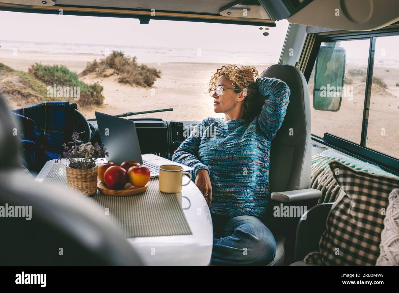 Living and working inside camper van vehicle in travel and digital ...