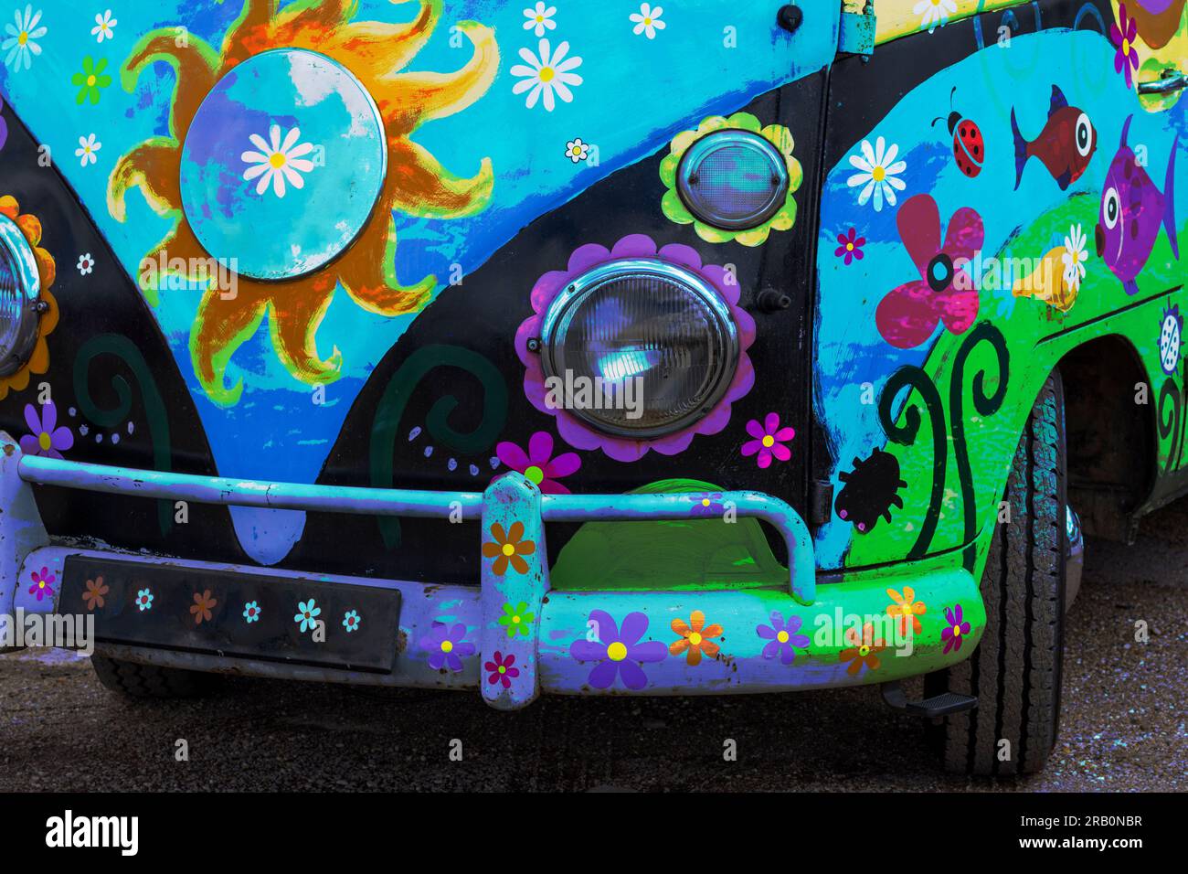 The bonnet of a 1960's camper van decorated in floral motifs with an ...