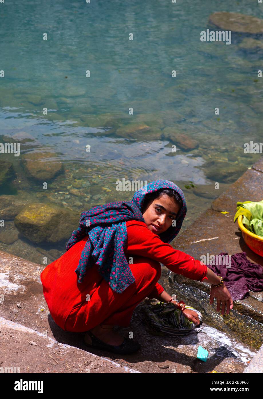 Indian woman washing clothes in a pond, Jammu and Kashmir, Kangan ...