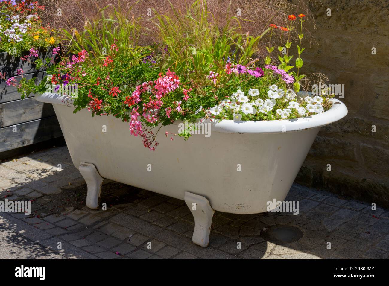 Old bathtub as a flower trough hi-res stock photography and images - Alamy