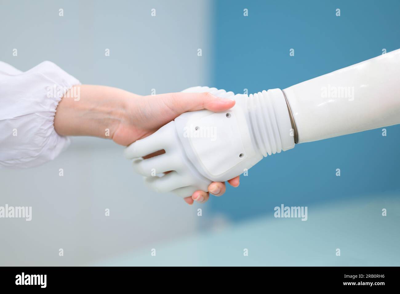 Technician testing robotic bionic arm at prosthetic manufacturing Stock ...