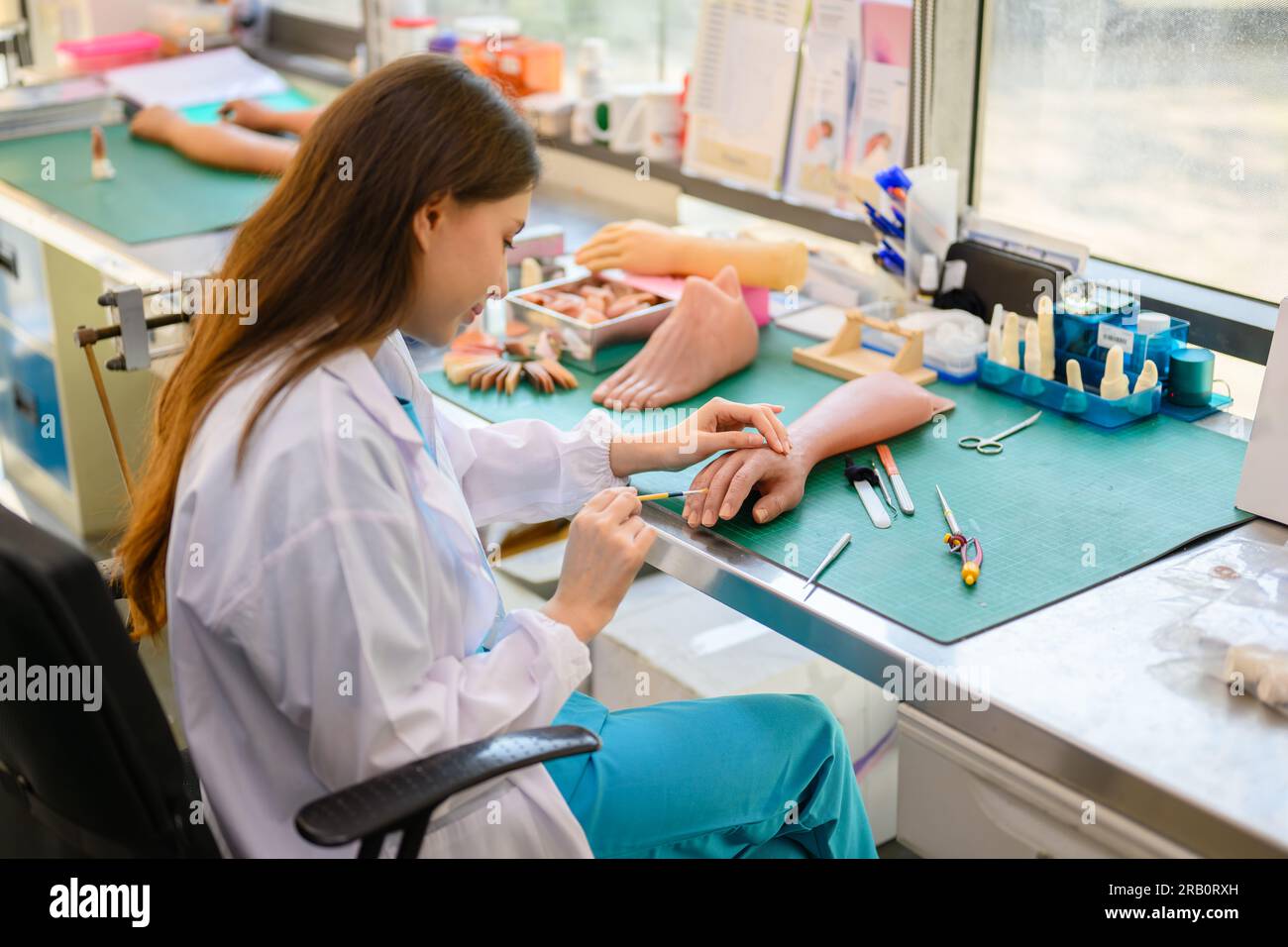 Technician making prosthetic limb device at laboratory Stock Photo - Alamy