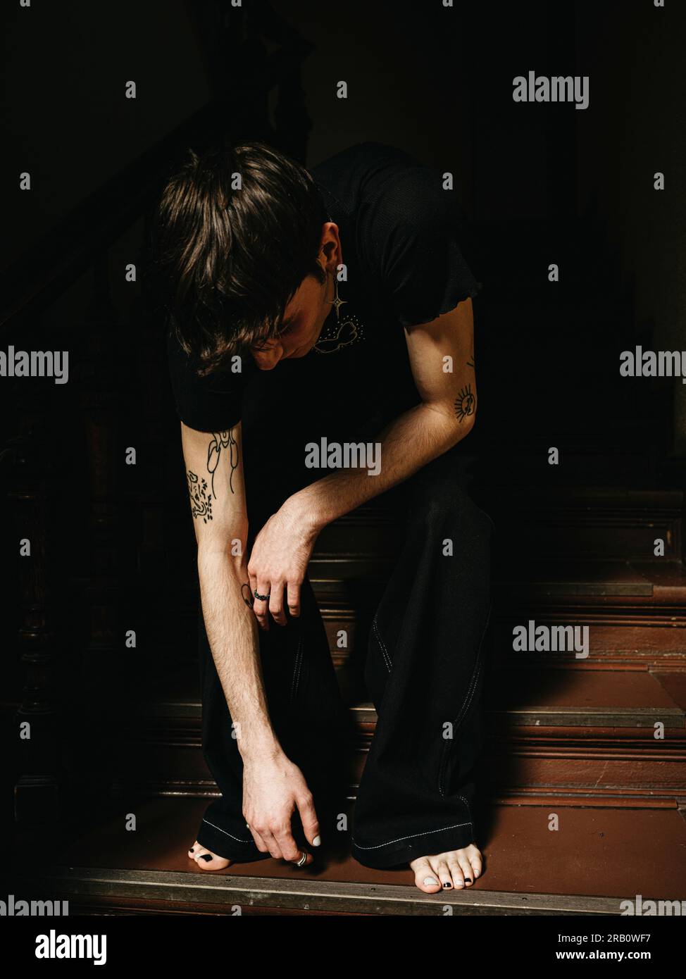 Non binary person in staircase hi-res stock photography and images - Alamy