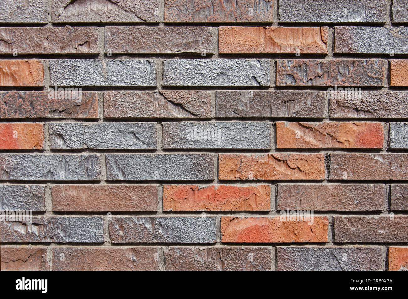Detail of a wall with modern bricks, artificially roughened, in various ...