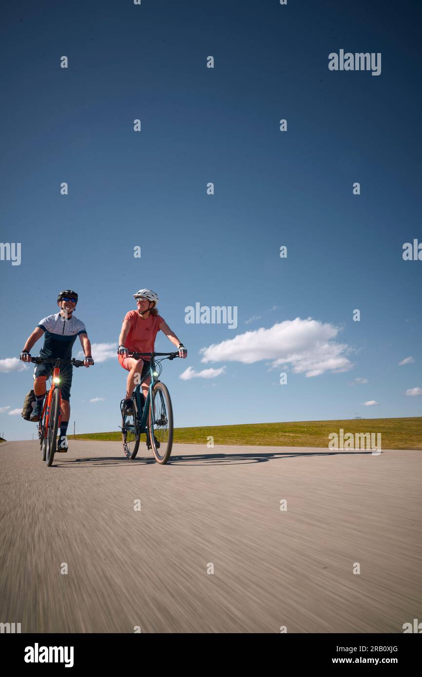 Couple, man and woman touring with bicycles, trekking bike Stock Photo ...