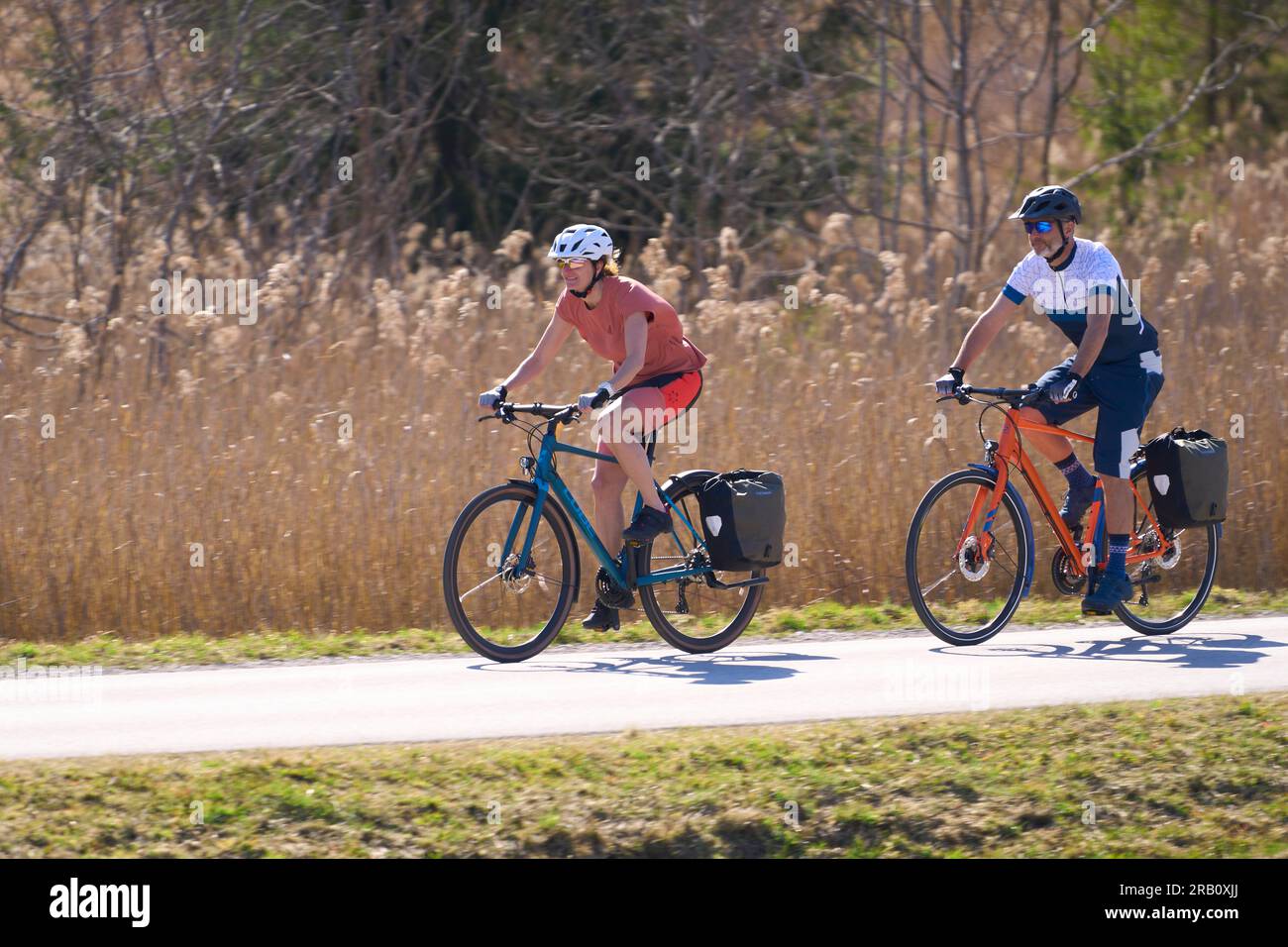 Couple, man and woman touring with bicycles, trekking bike Stock Photo ...